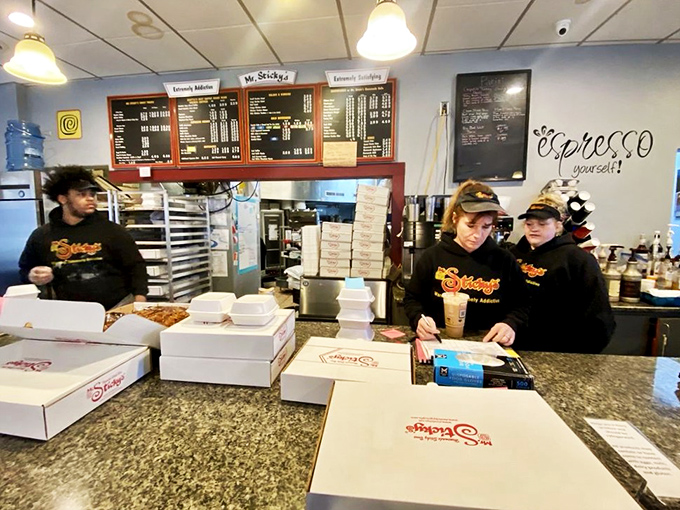 The sticky bun special forces team, ready to deploy happiness in cardboard boxes. Their uniforms say business, but their products scream pleasure.
