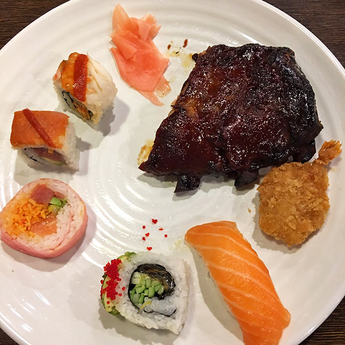 The plate that silences the "I can't decide between sushi or barbecue" debate. Why choose when you can have perfectly seared ribs alongside delicate maki?