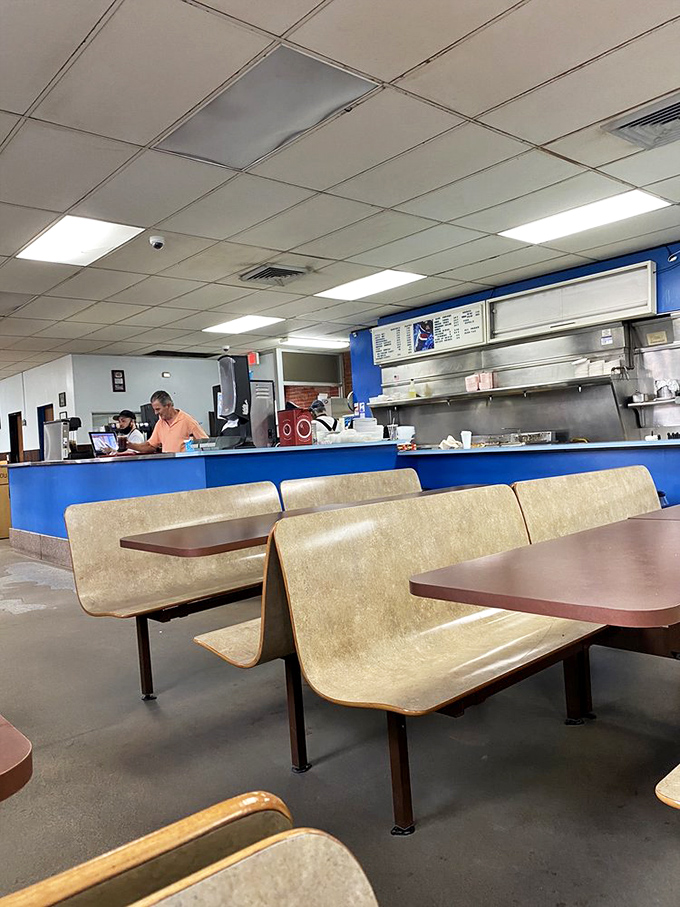 Decades of diners have occupied these seats, experiencing the transcendent moment when chaotic ingredients become comfort food perfection.