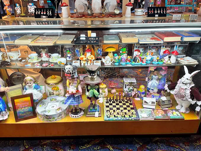 A display case that's practically bursting with whimsy. Those chess pieces aren't just playing a game&mdash;they're guarding miniature wonderlands.