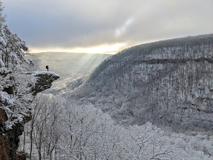 Winter blankets the Buffalo River wilderness in pristine white, creating a hushed cathedral where even the most chatty hikers fall silent in awe.