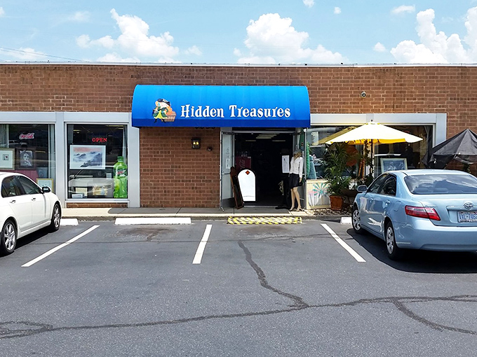 That bright blue awning signals a sanctuary for thrift lovers where yesterday's castoffs become tomorrow's conversation pieces.
