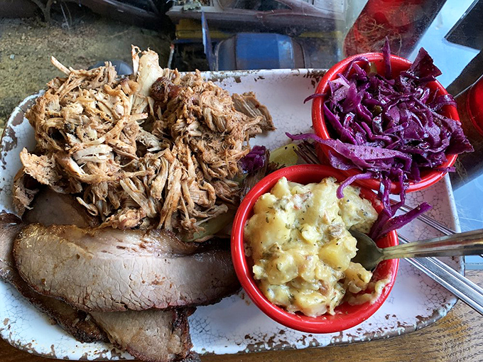 A two-meat platter that doubles your pleasure with complementary sides, proving that sometimes more really is more in barbecue mathematics.