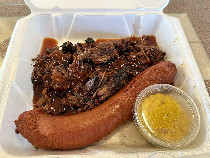 A platter that answers the eternal question: "Why choose?" Brisket and sausage living together in perfect harmony, with a side of liquid gold.