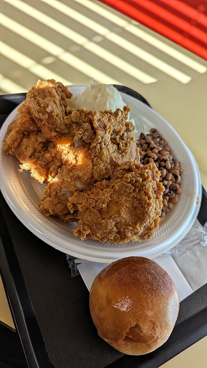 Fried chicken so perfect it deserves its own ZIP code. That crust shatters with military precision while protecting chicken juicy enough to require a bib.