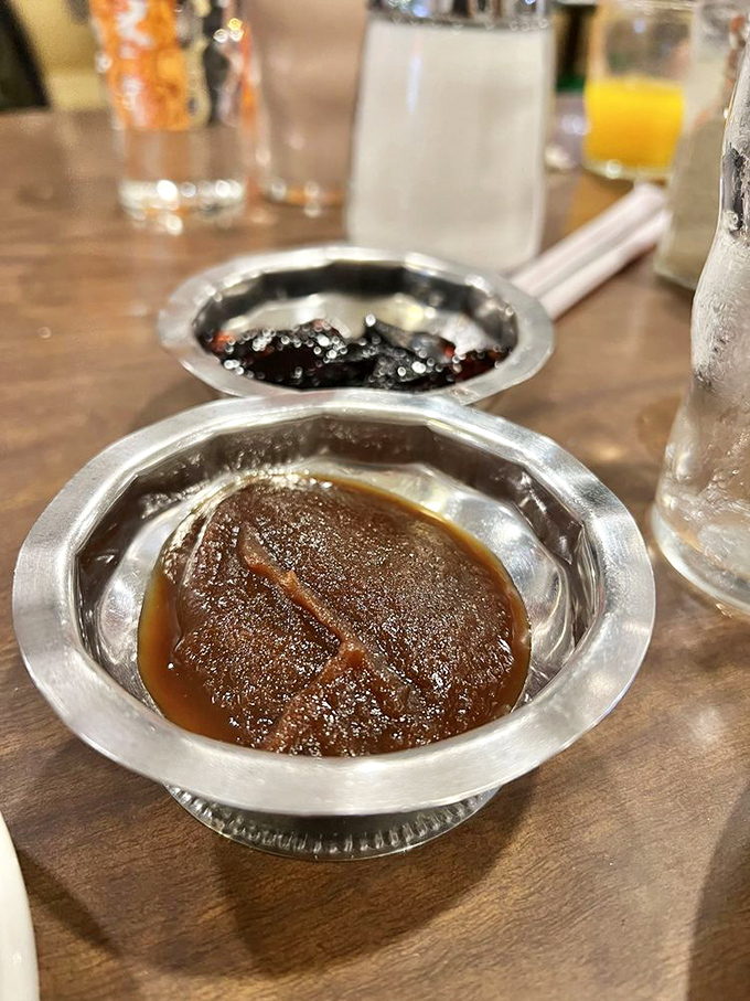 Condiment royalty holding court&mdash;apple butter and preserves waiting to transform ordinary pancakes into something worth writing home about.