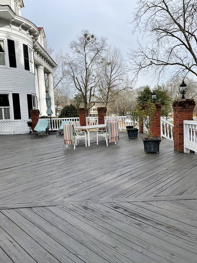 Winter on the porch&mdash;still utterly charming. Those brick pillars and white railings frame a peaceful retreat from the world, no matter the season.