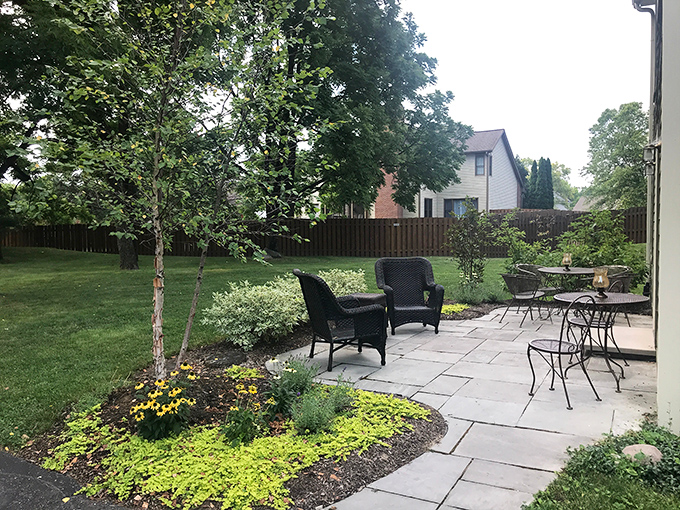 Garden seating arranged with such precision you'll feel compelled to finally read that book you've been carrying around for show.