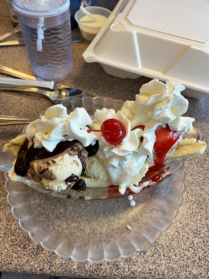The banana split&mdash;where ice cream wears whipped cream formal attire and cherries serve as the crowning jewels of dessert royalty.