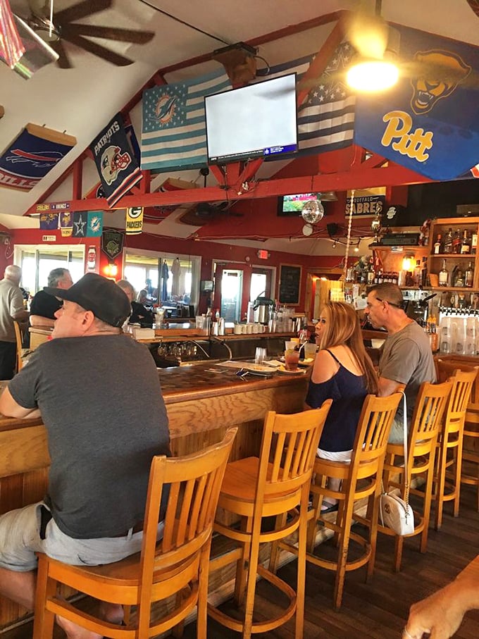 The bar stools at CCF Bayside are like front-row seats to the Super Bowl of seafood. Sports pennants create the perfect game-day ambiance.