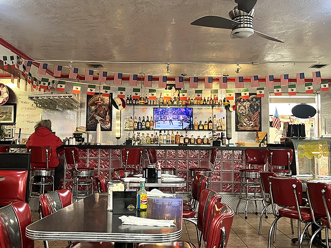The bar area, where American and Mexican flags hang side by side, much like the menu that celebrates both culinary traditions.