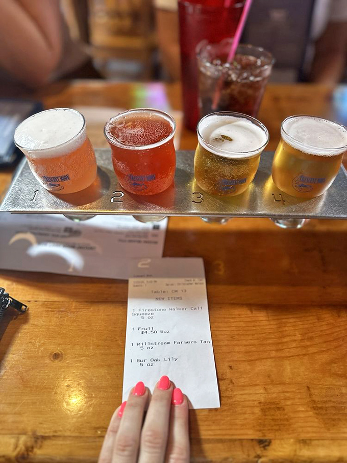 The beer flight offers liquid geography – four distinct brews lined up like eager contestants in a delicious beauty pageant.