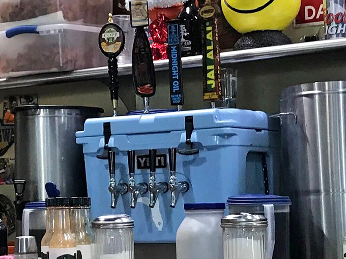 Craft beer flows from taps attached to a cooler that's seen more good times than a Jimmy Buffett concert. Florida ingenuity at its finest.