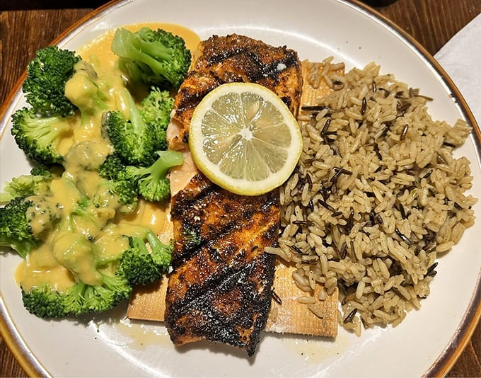 Blackened salmon that found the perfect balance between spice and tenderness, flanked by wild rice and cheese-draped broccoli.