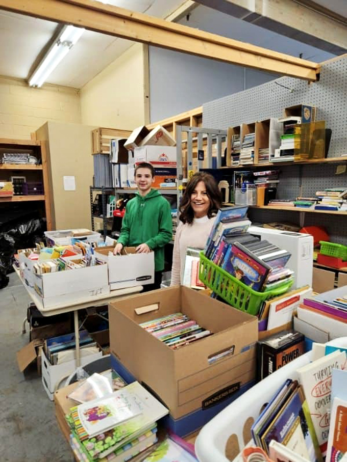 Literary treasures await sorting by volunteers whose expressions suggest they might be finding books they'll "accidentally" take home themselves. 