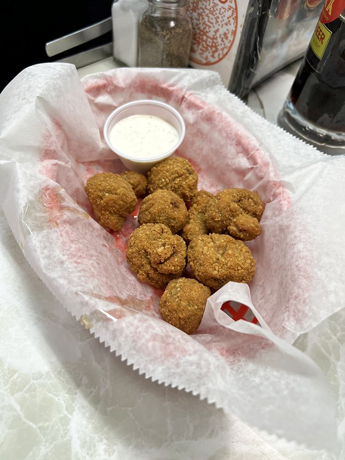 Golden-fried mushroom morsels that crunch like nature's popcorn. The dipping sauce isn't optional&mdash;it's the perfect dance partner for these crispy delights.