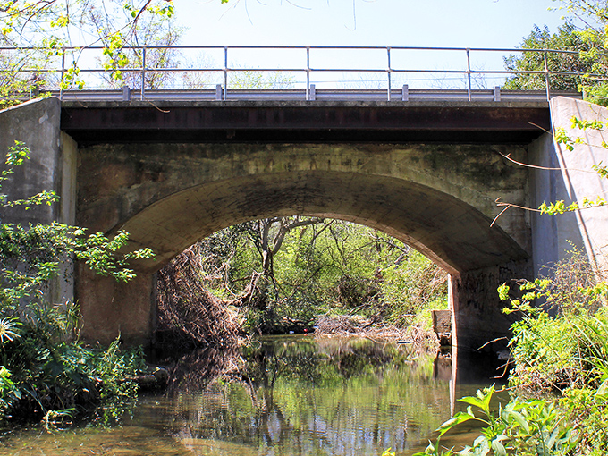 This humble bridge spans more than just water—it connects modern Lockhart to its pastoral roots in quiet, understated Texas fashion.