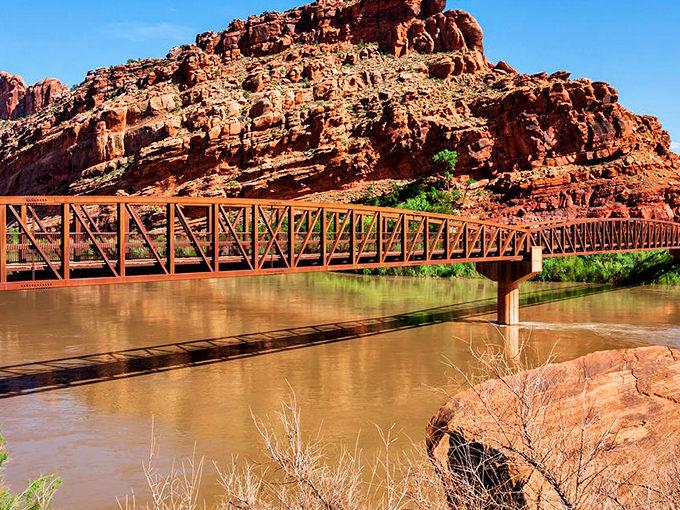 This isn't just any bridge—it's the portal between everyday life and river adventures, connecting civilized Moab to wild canyon country.