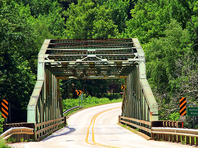 This isn't just any bridge – it's a portal between everyday life and the wild beauty of Buffalo River country.
