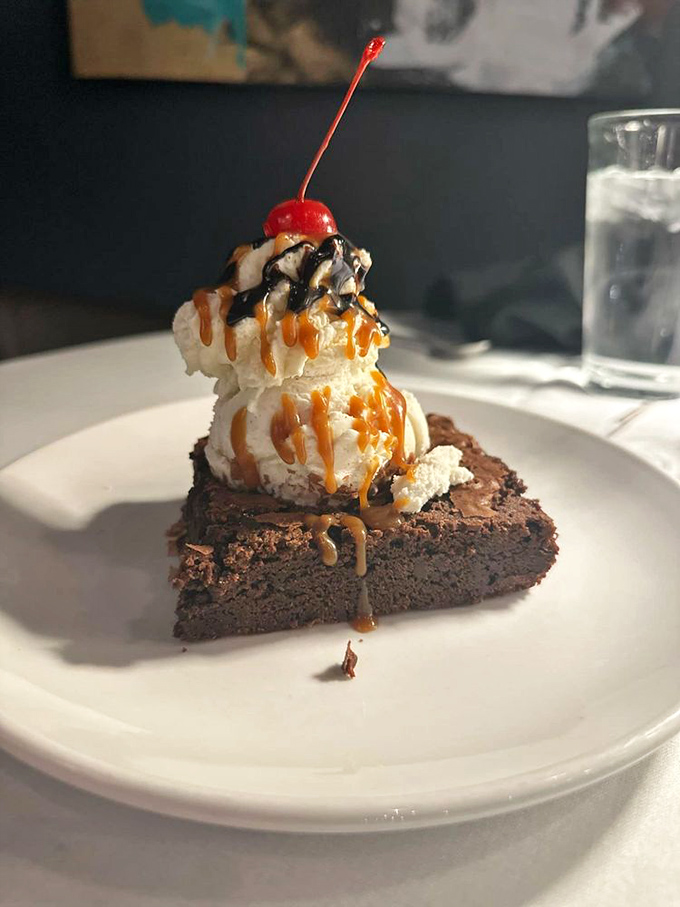 Dessert with dramatic flair&mdash;this brownie supports a tower of ice cream like it's the foundation of a delicious skyscraper. That cherry on top isn't garnish; it's punctuation.