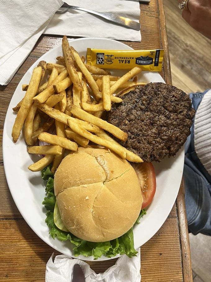 A burger that doesn't need trendy toppings to make a statement—just honest beef, fresh vegetables, and fries golden enough to make Fort Knox jealous.
