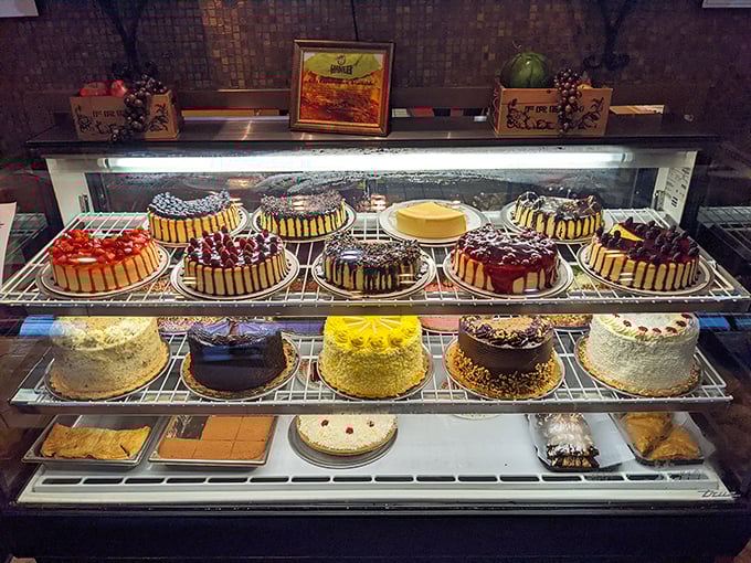 A dessert case that doesn't whisper temptation but shouts it through a megaphone, making willpower shrivel like spinach in a hot pan.