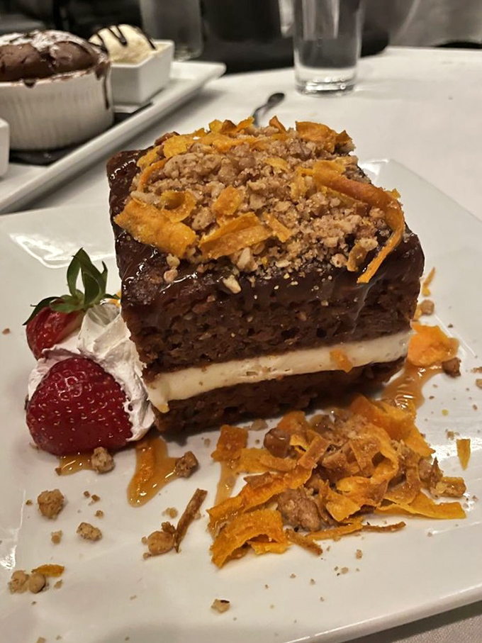 Carrot cake elevated to art form&mdash;layered, topped with crunchy bits, and served with fresh strawberry. Vegetables never had it so good.