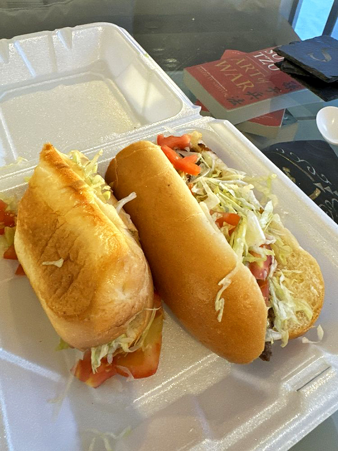 Two sandwiches on classic red-and-white checked paper&mdash;the universal signal that good, honest food is about to happen.