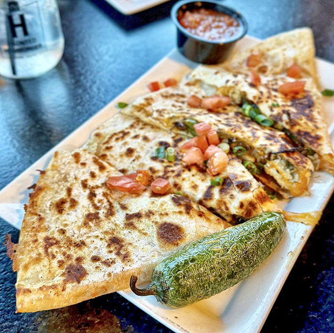This quesadilla isn't playing around—it's serious about that roasted pepper, melty cheese, and that grilled jalapeño standing guard.