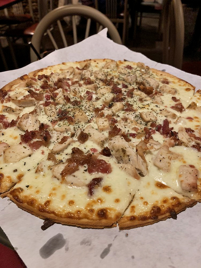 A pizza that understands the perfect ratio of cheese to toppings. That chicken and bacon combo is the dynamic duo of the culinary world.