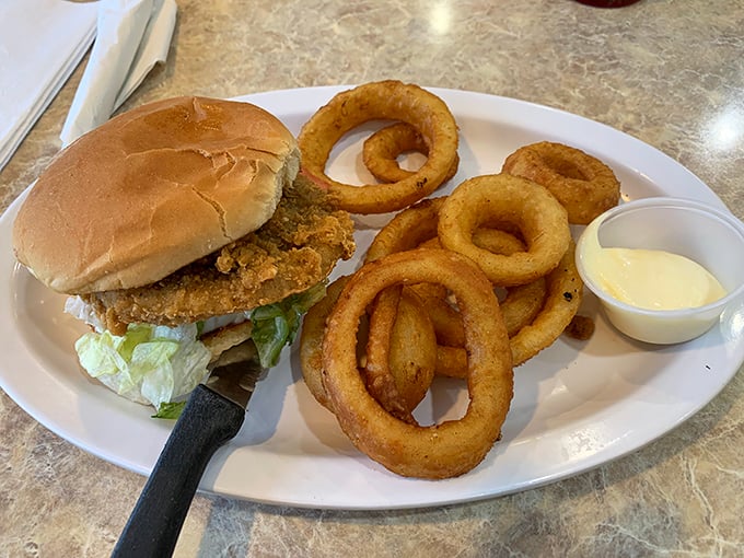 This isn't some fancy gastropub's "elevated" sandwich&mdash;it's the real deal: crispy chicken, fresh lettuce, and onion rings that could double as delicious bracelets.