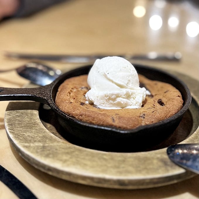 A skillet cookie that arrives still bubbling with anticipation, topped with ice cream melting into all the right crevices. Dessert nirvana has been achieved.