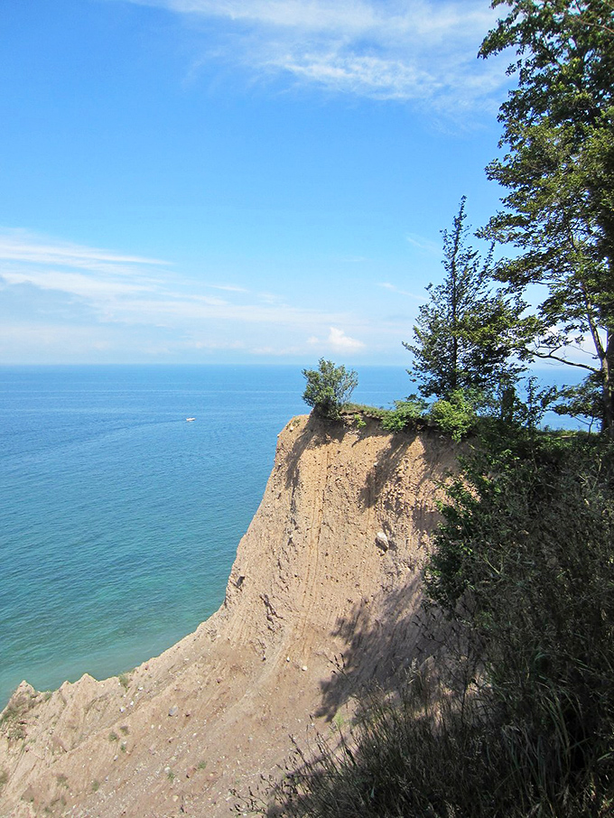 The cliff face drops dramatically to the water below, a geological mic drop that's been wowing visitors since before mic drops were cool.