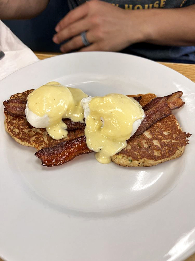 Eggs Benedict gets a Southern makeover with corn cakes as the foundation and hollandaise as the crowning glory.