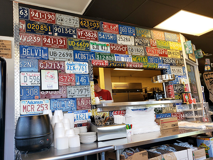 License plates from across America form a patriotic tapestry of road trips, all leading to this sandwich sanctuary. 