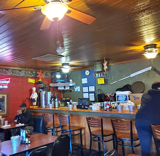 The bar area serves as command central, where sweet tea flows as freely as the conversation between neighbors and newcomers alike.