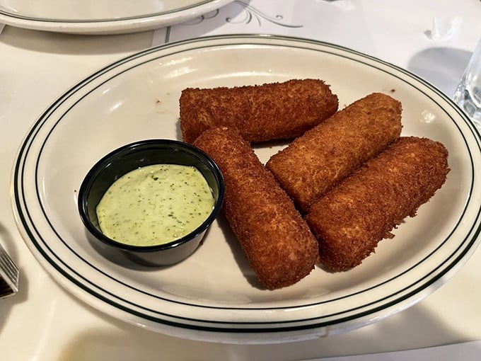 Croquetas&mdash;the Cuban answer to "What if we made happiness bite-sized?" Crispy outside, creamy inside, and utterly impossible to eat just one.