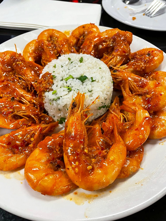 These shrimp are dressed for success, circling a perfect dome of rice like synchronized swimmers in a spicy sauce spectacular.