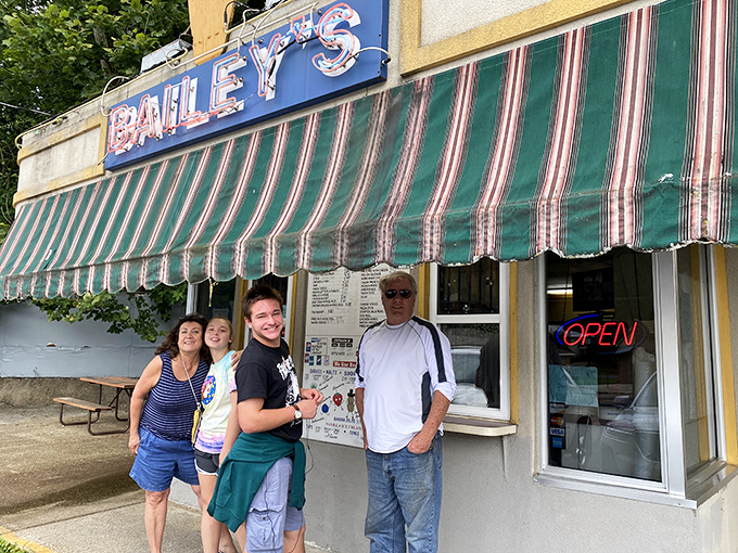 Pilgrims at the altar of frozen dairy, making memories sweeter than any cone. Everyone's smiling because they know what's coming.