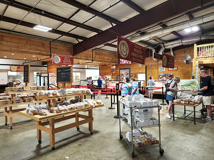 The pilgrimage to pastry paradise. Locals and tourists alike line up for their chance at fried pie glory under string lights and pine walls.