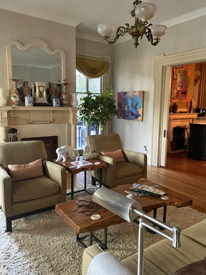 The living room's perfect balance of elegance and comfort invites lingering conversations, perhaps with a glass of wine as afternoon turns to evening.