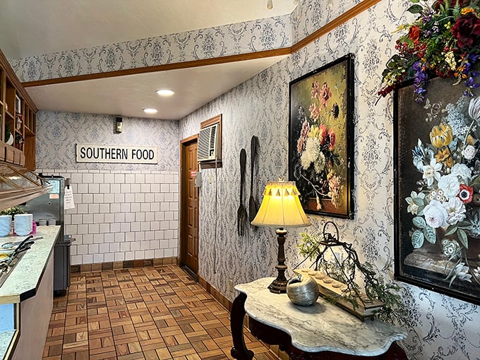 Blue booths and floral wallpaper create the perfect backdrop for the serious business of comfort food consumption. Norman Rockwell would approve.