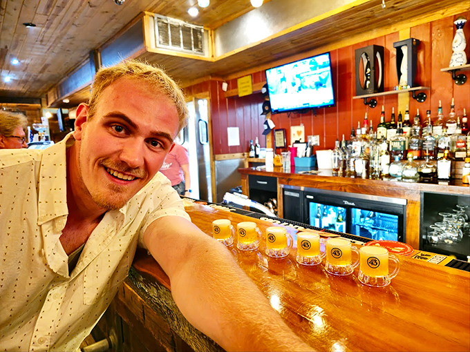 The cozy wood-paneled bar area invites lingering conversations, with beer glasses lined up like soldiers ready for refreshment duty.