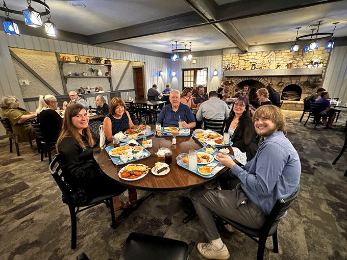 Happy diners gathered around a feast that spans generations. When the food arrives, conversation pauses&mdash;the highest compliment in the Midwest.