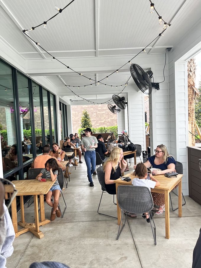 The outdoor seating area buzzes with diners enjoying their custom creations&mdash;proof that good food brings people together better than social media.