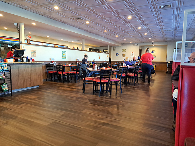 The dining room buzzes with the symphony of satisfaction &ndash; forks clinking, conversations flowing, and the occasional "mmm" rising above it all.