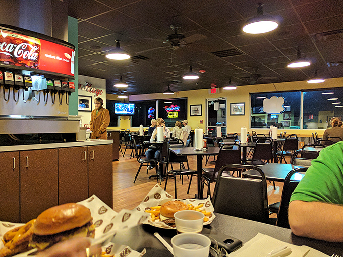 The dining room buzzes with the communal energy of strangers united by the universal language of good food.