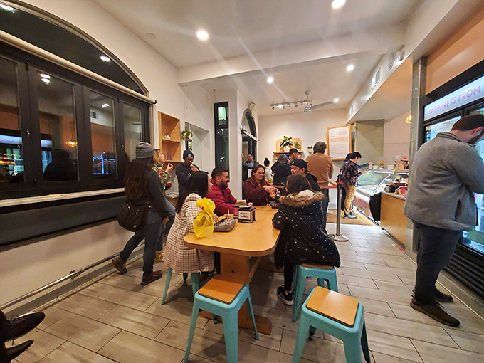 The communal table where strangers become friends. Ice cream has a way of breaking down barriers better than any icebreaker.