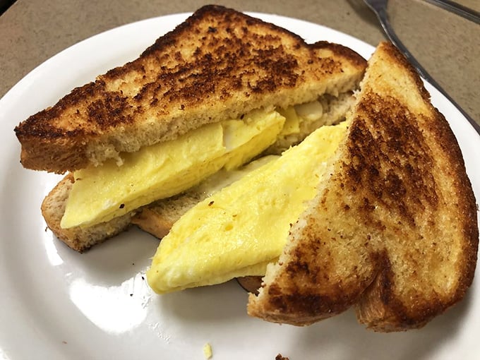 Even breakfast sandwiches get the royal treatment &ndash; golden-grilled bread embracing fluffy eggs and melted cheese in perfect harmony.