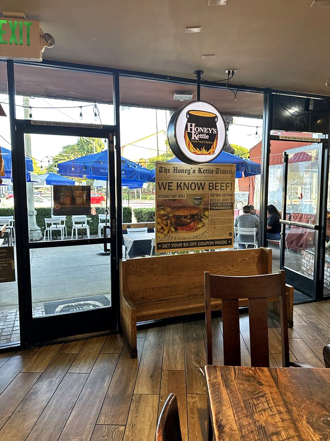 Sunlight streams through the entrance, illuminating wooden tables where countless fried chicken epiphanies have occurred.